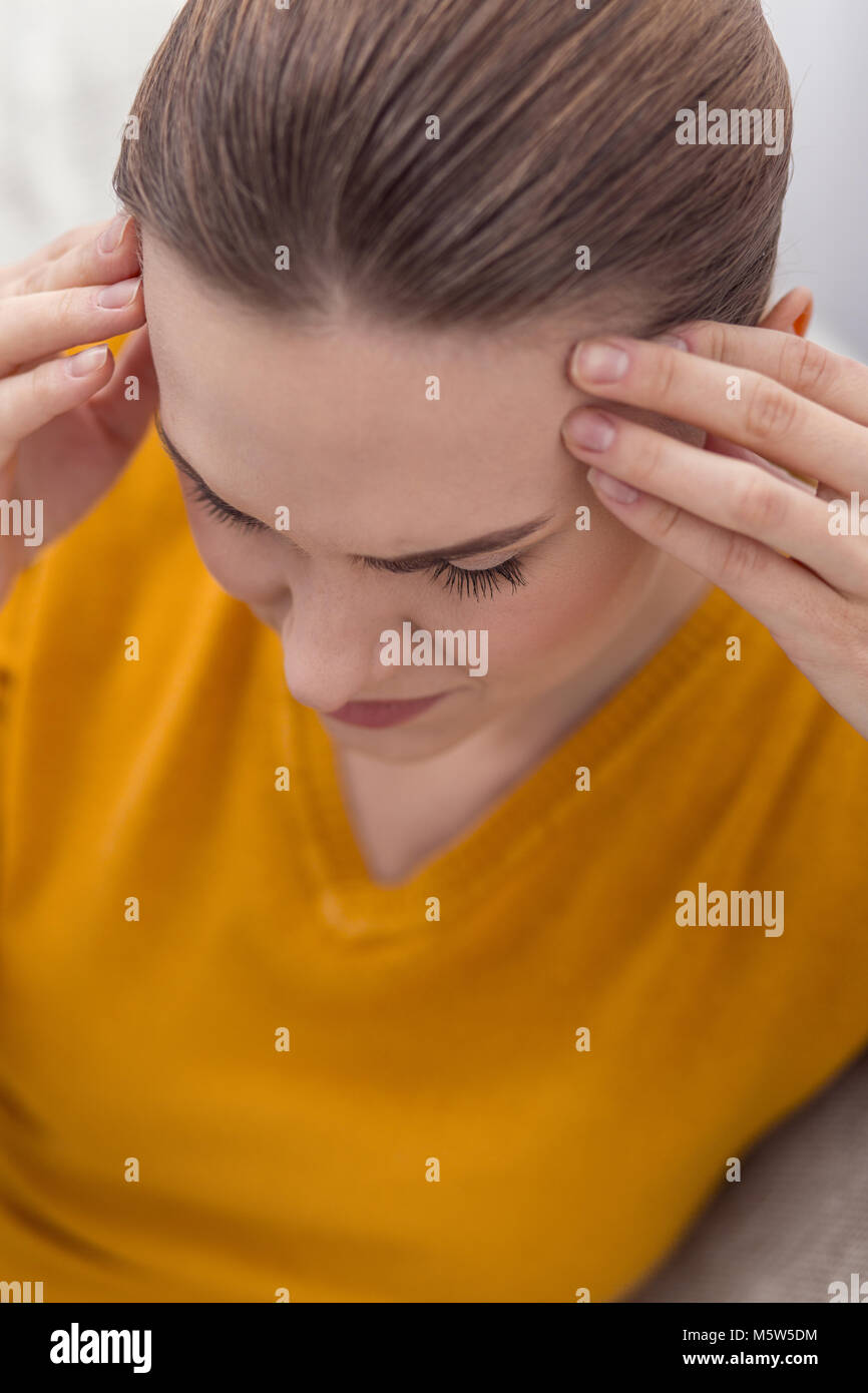 Young pretty woman relieving pain Stock Photo - Alamy