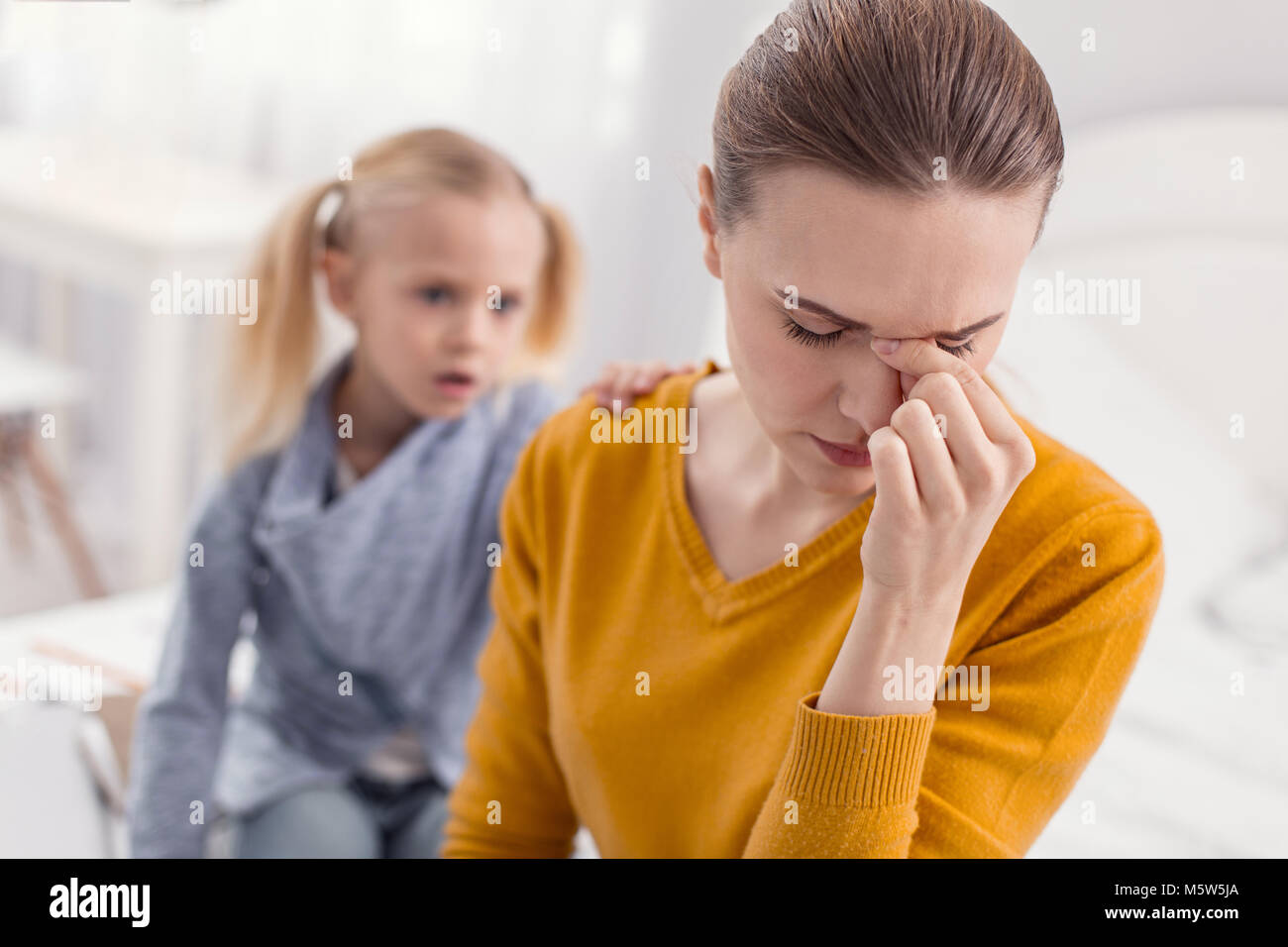 Sad single mom feeling helpless Stock Photo - Alamy