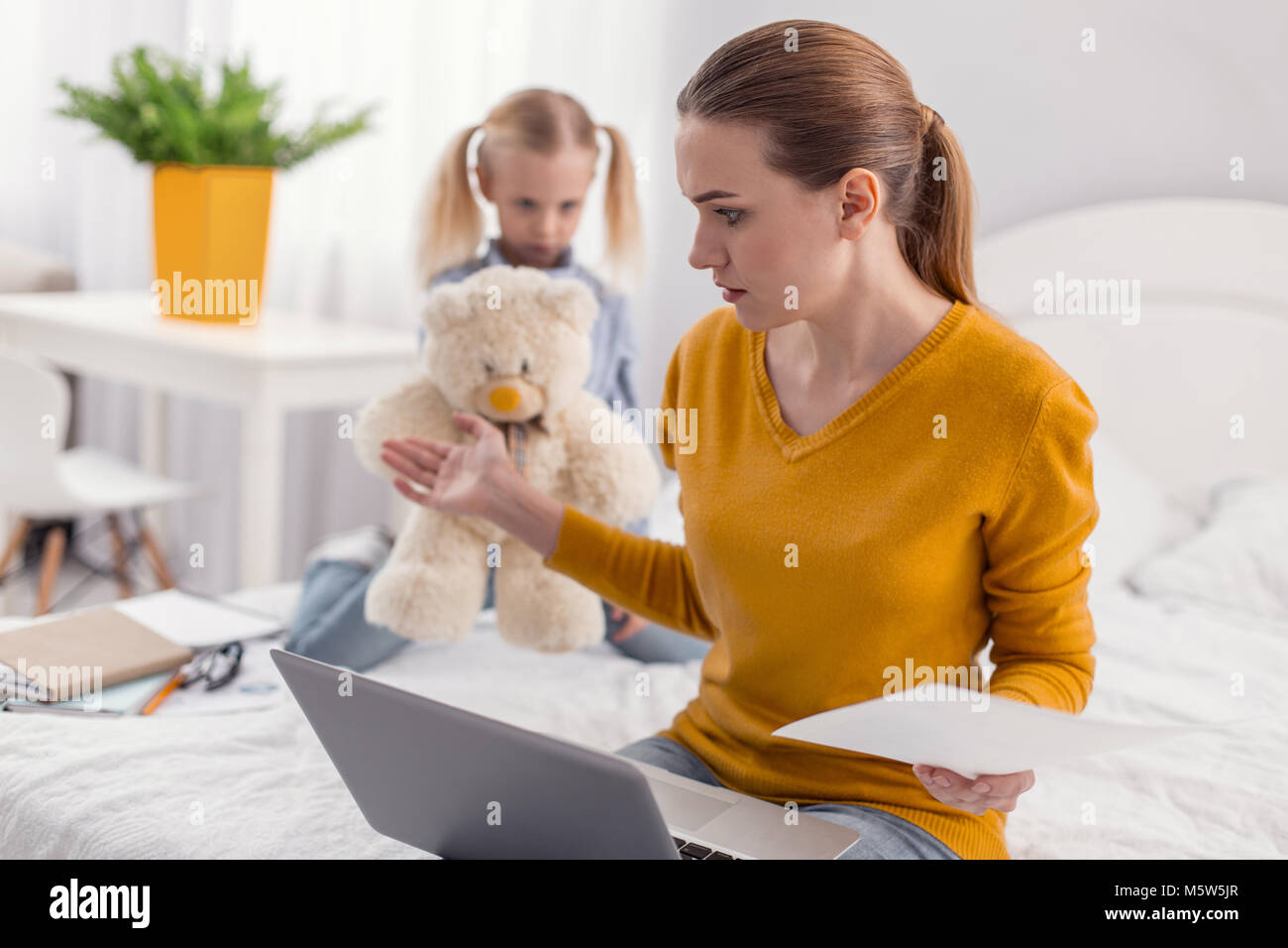 Stressful busy mother overloading with work Stock Photo - Alamy