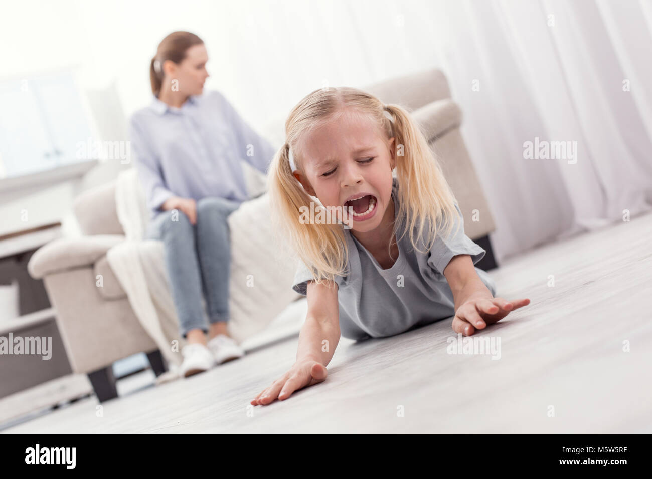 Wicked mischievous girl shouting in hysterics Stock Photo - Alamy