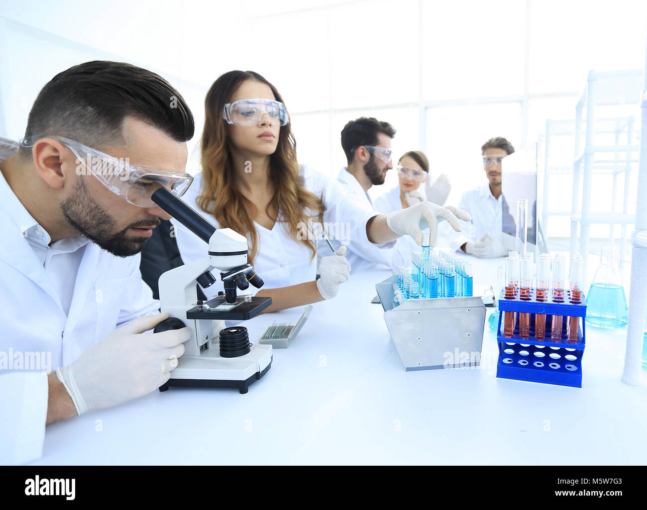 Team scientists laboratory workers tubes hi-res stock photography and ...