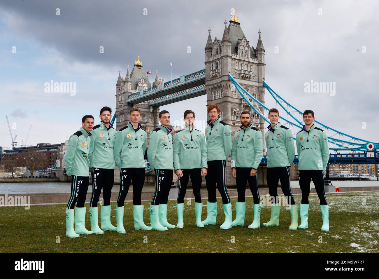 The Cambridge men's crew pose for a photograph in front of Tower Bridge ...
