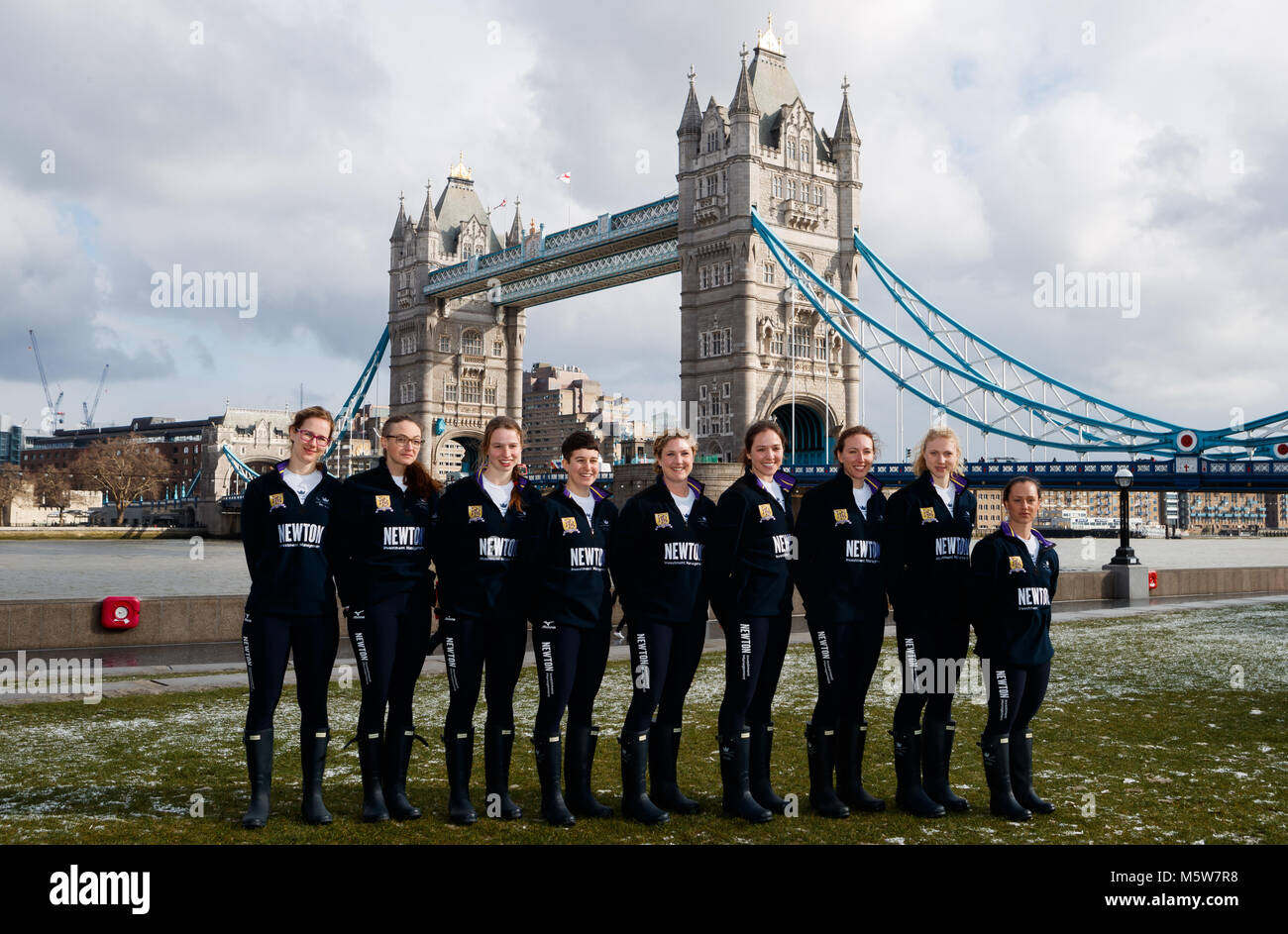 The Oxford Women's crew pose for a photograph in front of Tower Bridge ...