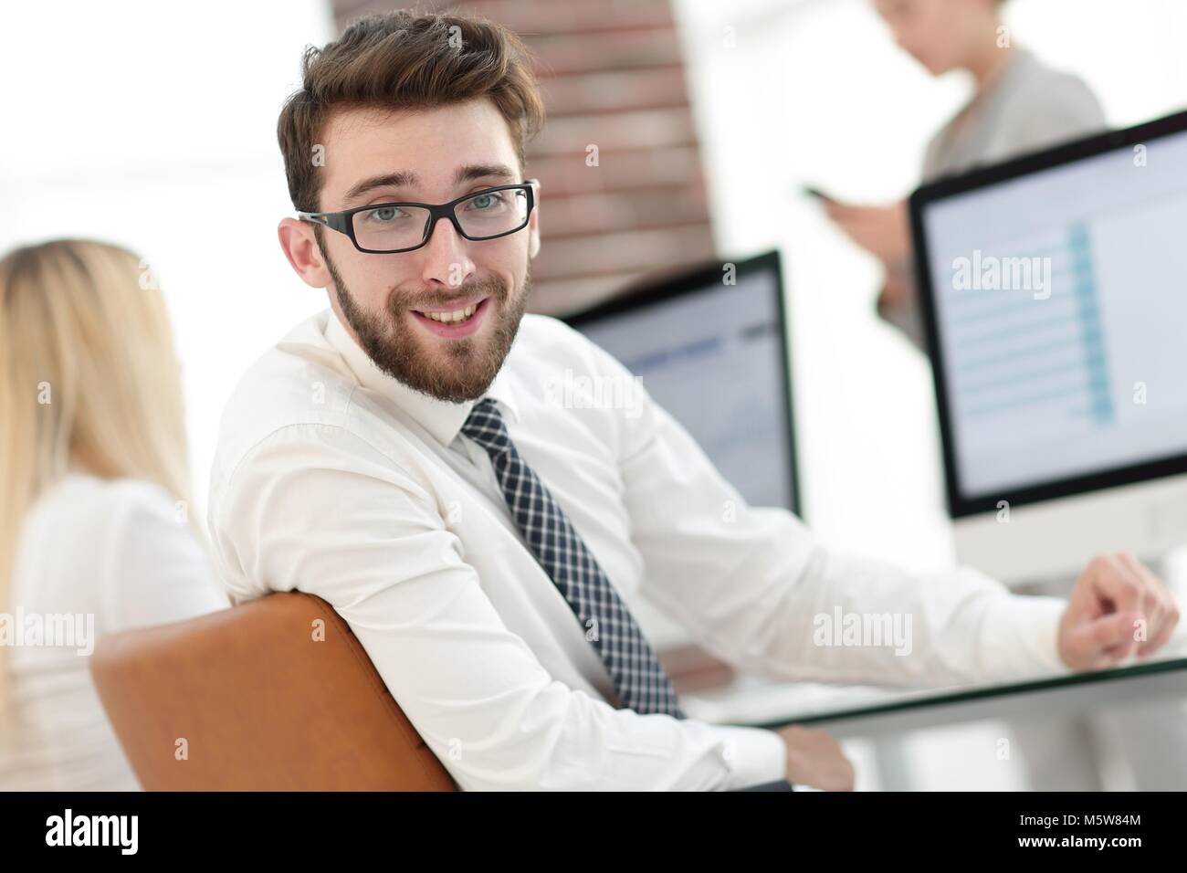 experienced programmer sitting in front of the monitor Stock Photo - Alamy