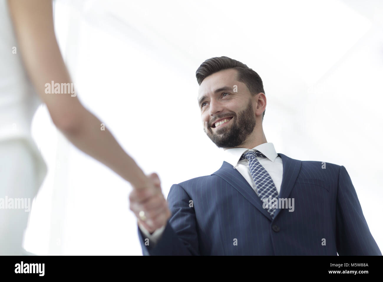 Image of business partners handshaking in office Stock Photo - Alamy