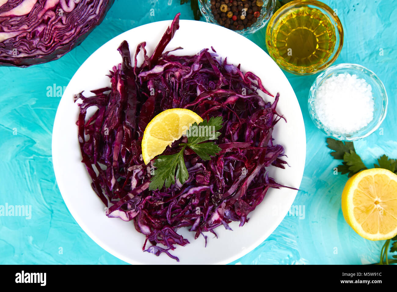 Shredded red cabbage in bowl on blue background. Vegetarian healthy ...