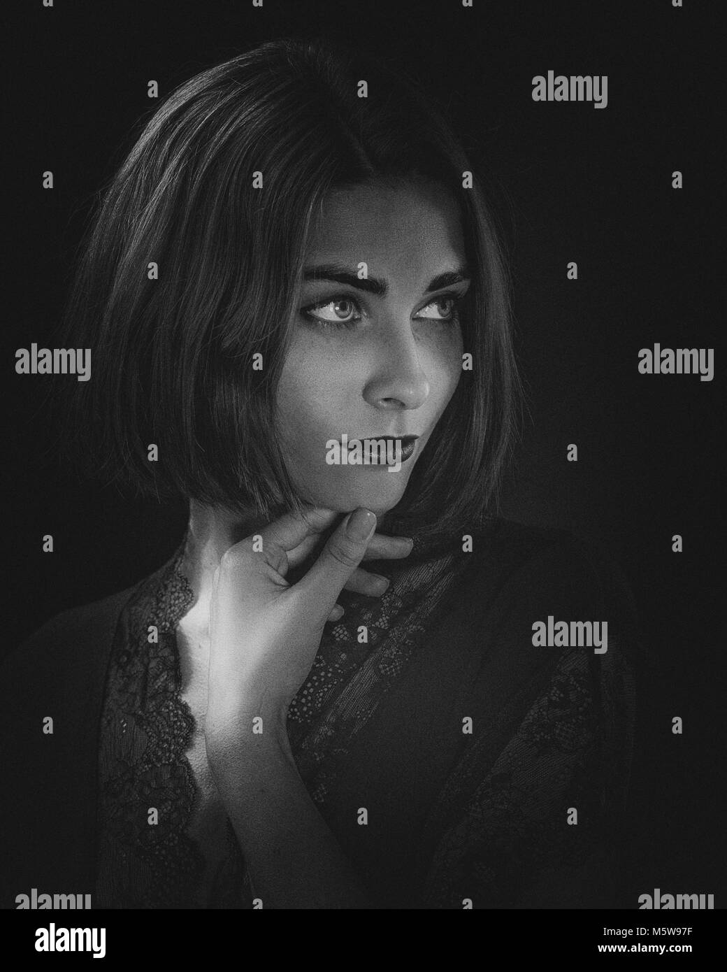 Dramatic female portrait against dark backgrounds Stock Photo - Alamy