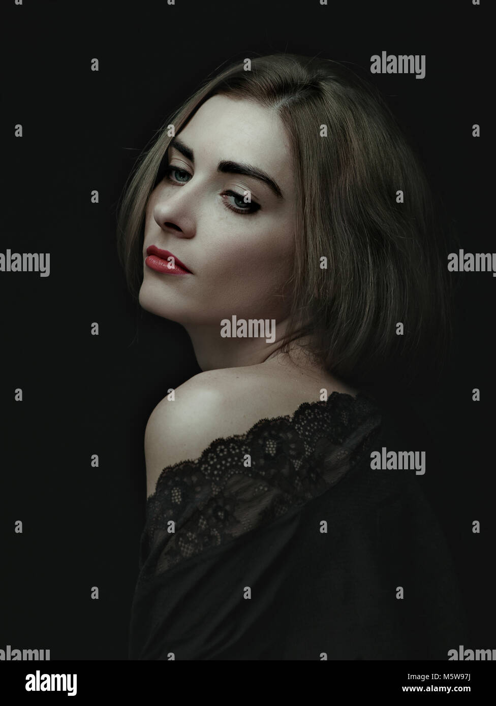 Dramatic female portrait against dark backgrounds Stock Photo - Alamy