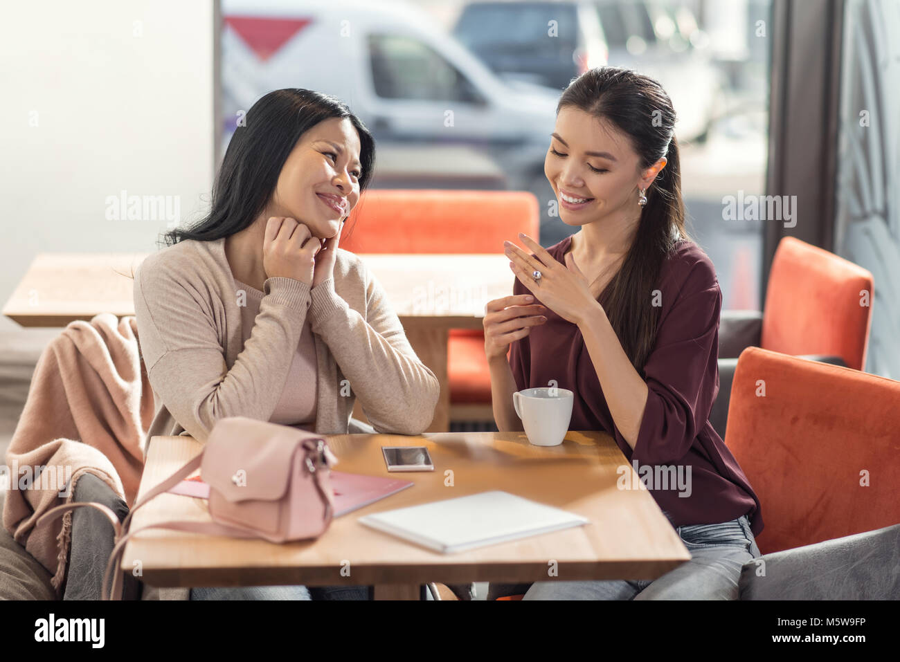 Positive young woman being happy Stock Photo - Alamy