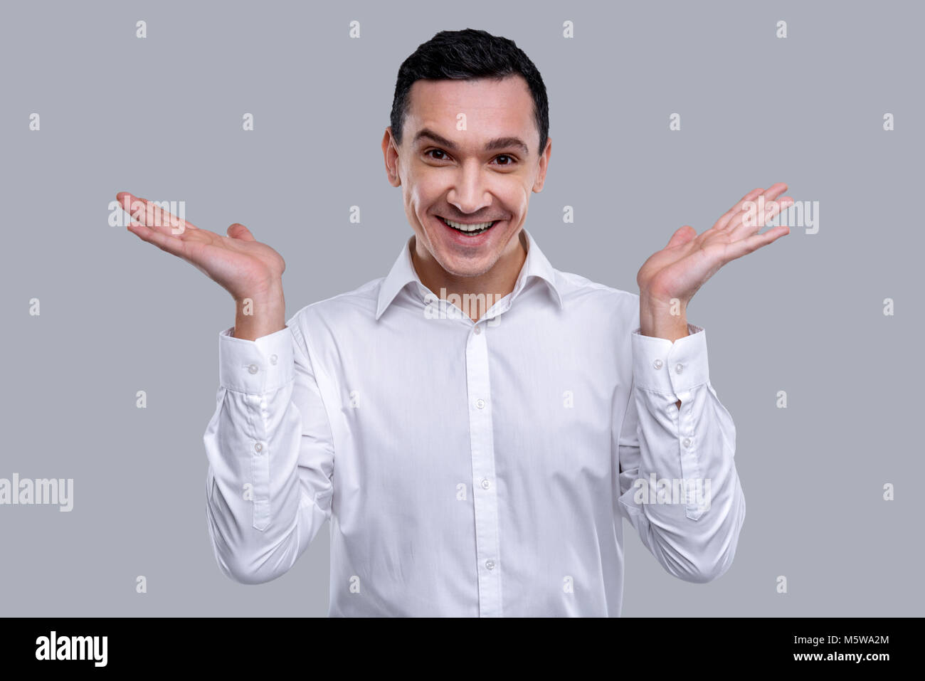Alert young man expressing happiness Stock Photo - Alamy
