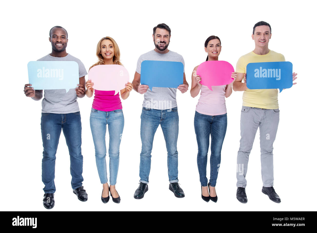 Happy best friends holding tables Stock Photo - Alamy