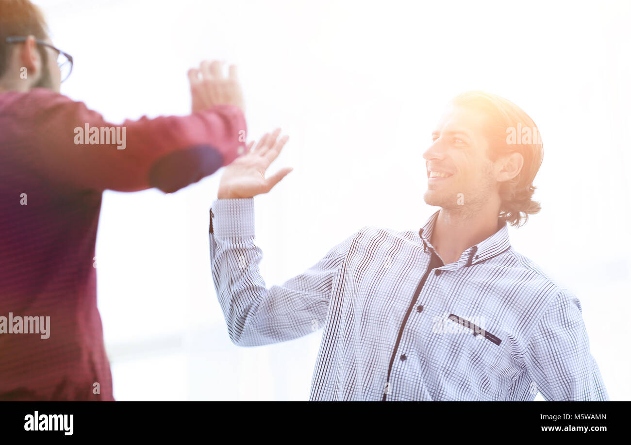 two business men giving each other a high five Stock Photo - Alamy