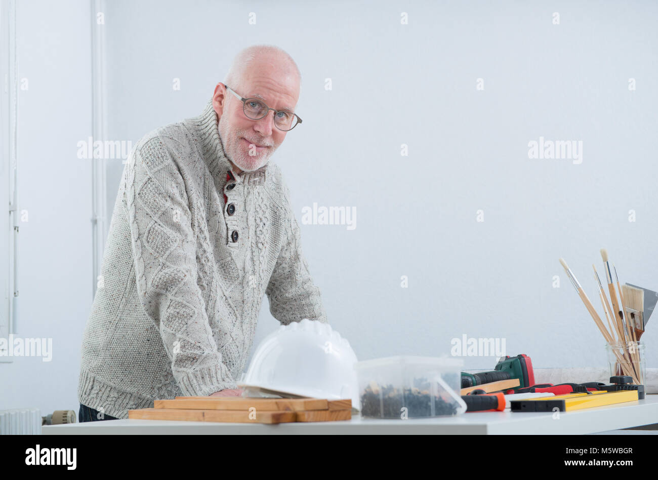 Man doing diy hi-res stock photography and images - Alamy