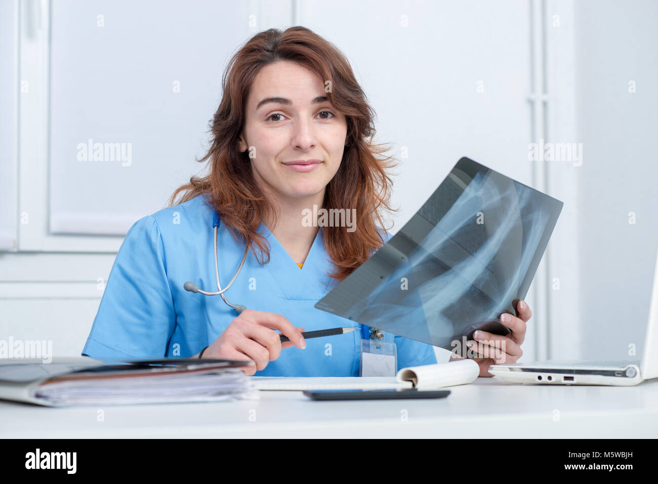 smiling medical woman doctor looking at scan image Stock Photo - Alamy