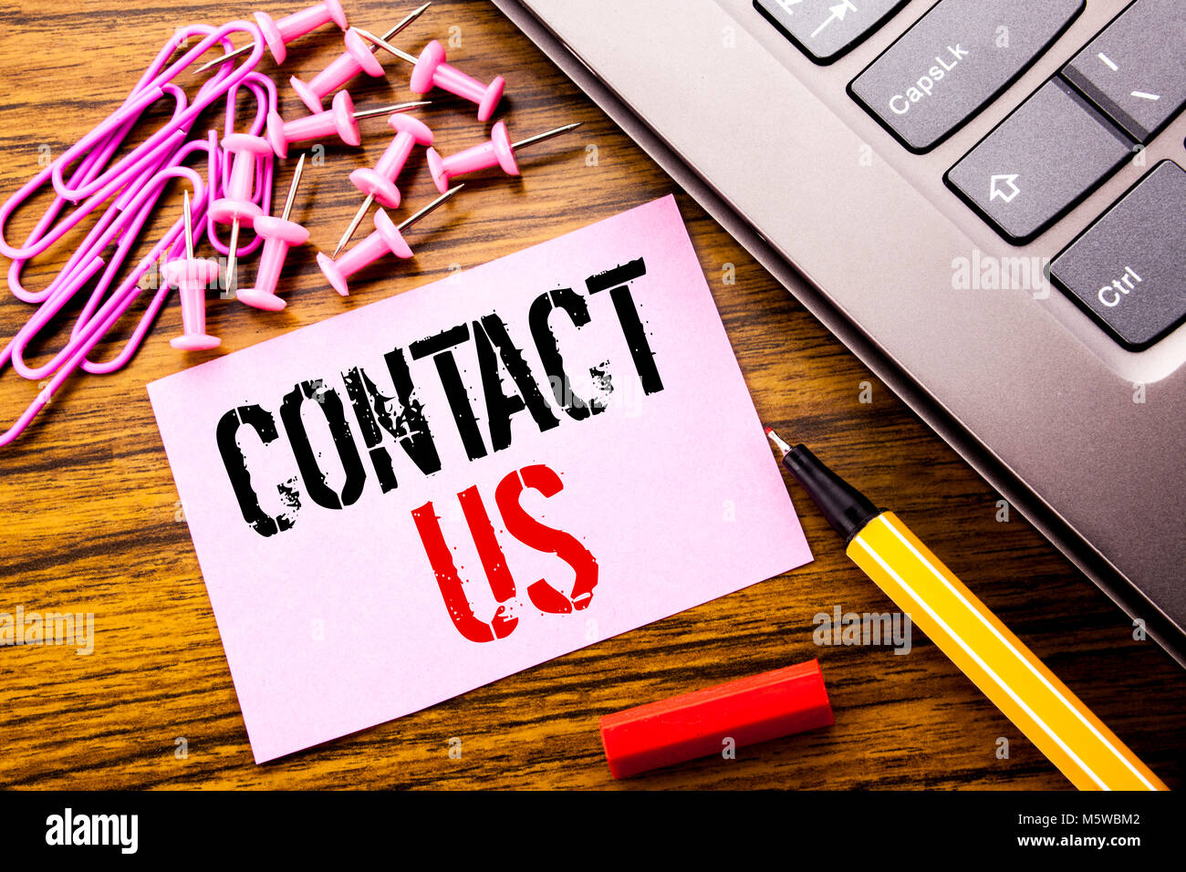 Handwritten text showing Contact Us. Business concept for Customer ...