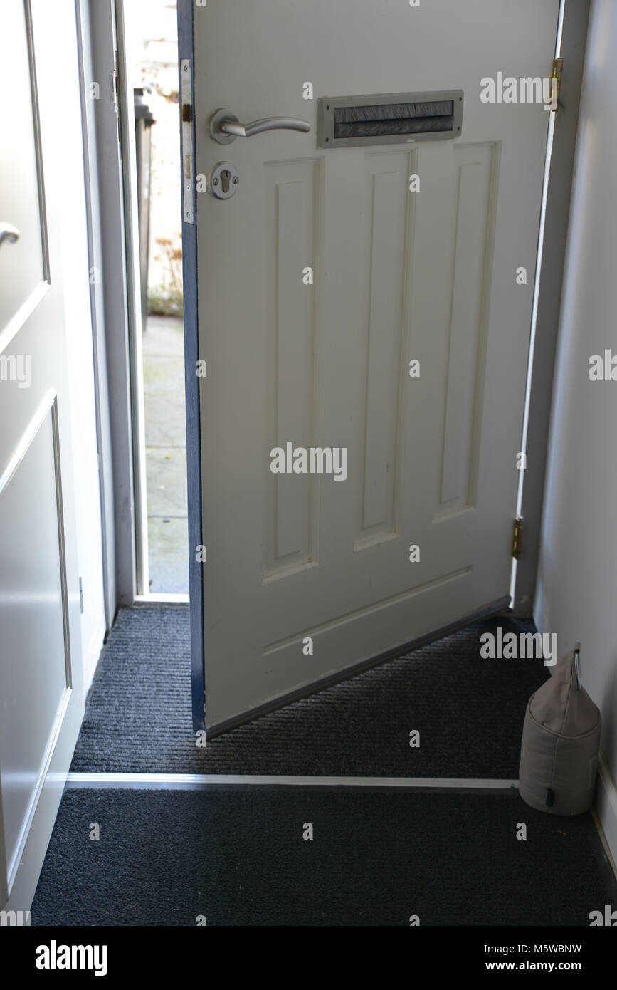 front door little bit open Stock Photo - Alamy