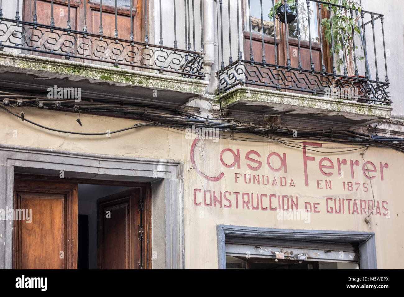 Ancient facade shop, casa ferrer, guitar construction.Granada, Spain ...