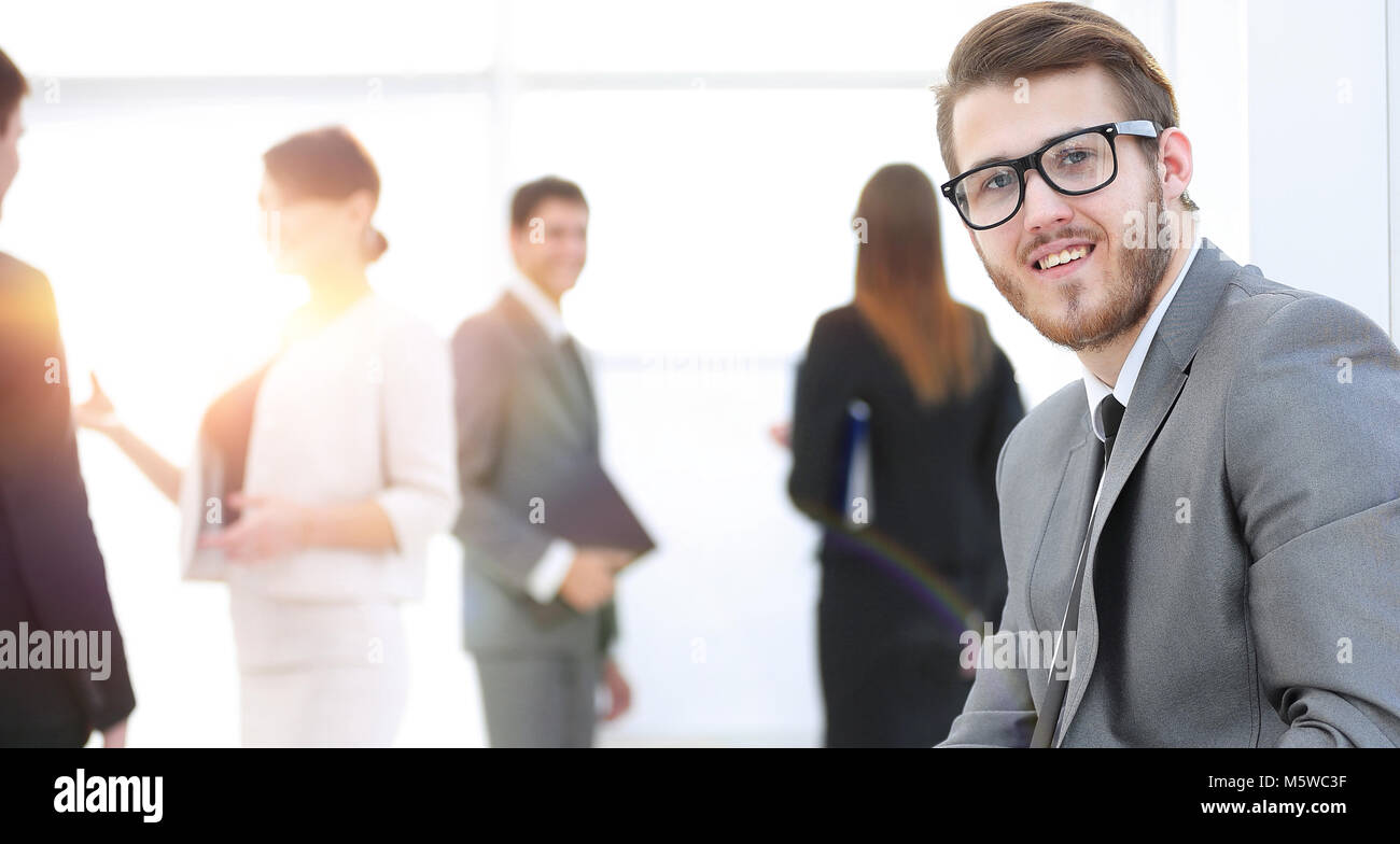 Manager with documents on the background of colleagues Stock Photo - Alamy