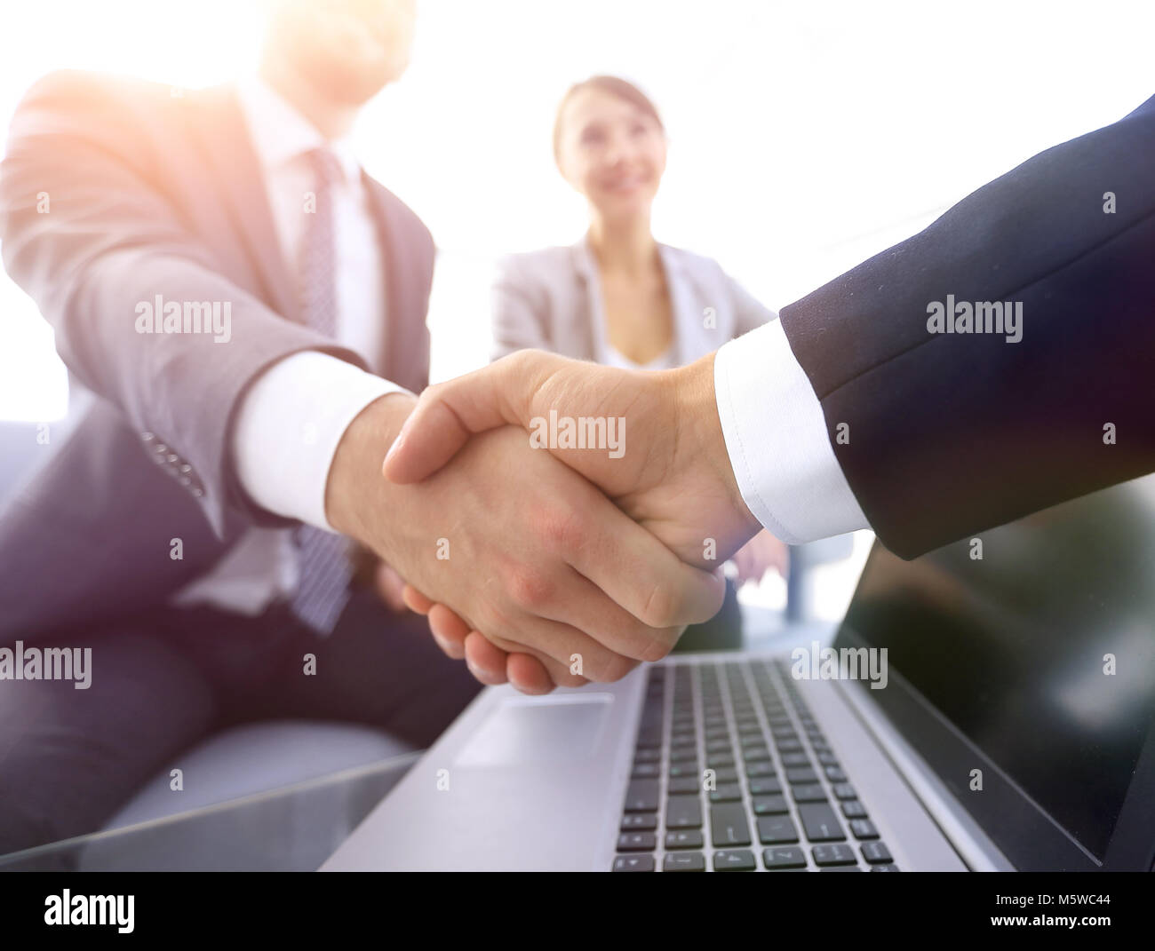 closeup. confident handshake colleagues Stock Photo - Alamy