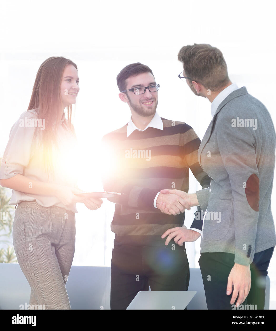 friendly handshake between colleagues Stock Photo - Alamy