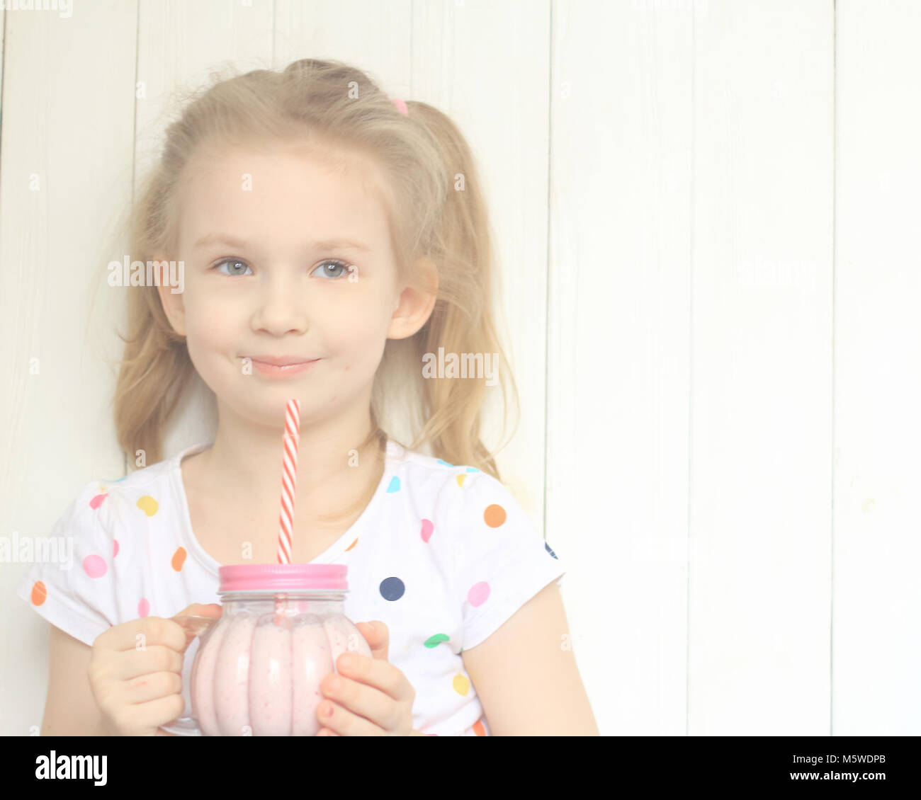 Beautiful girl drinking smoothie shake Stock Photo - Alamy