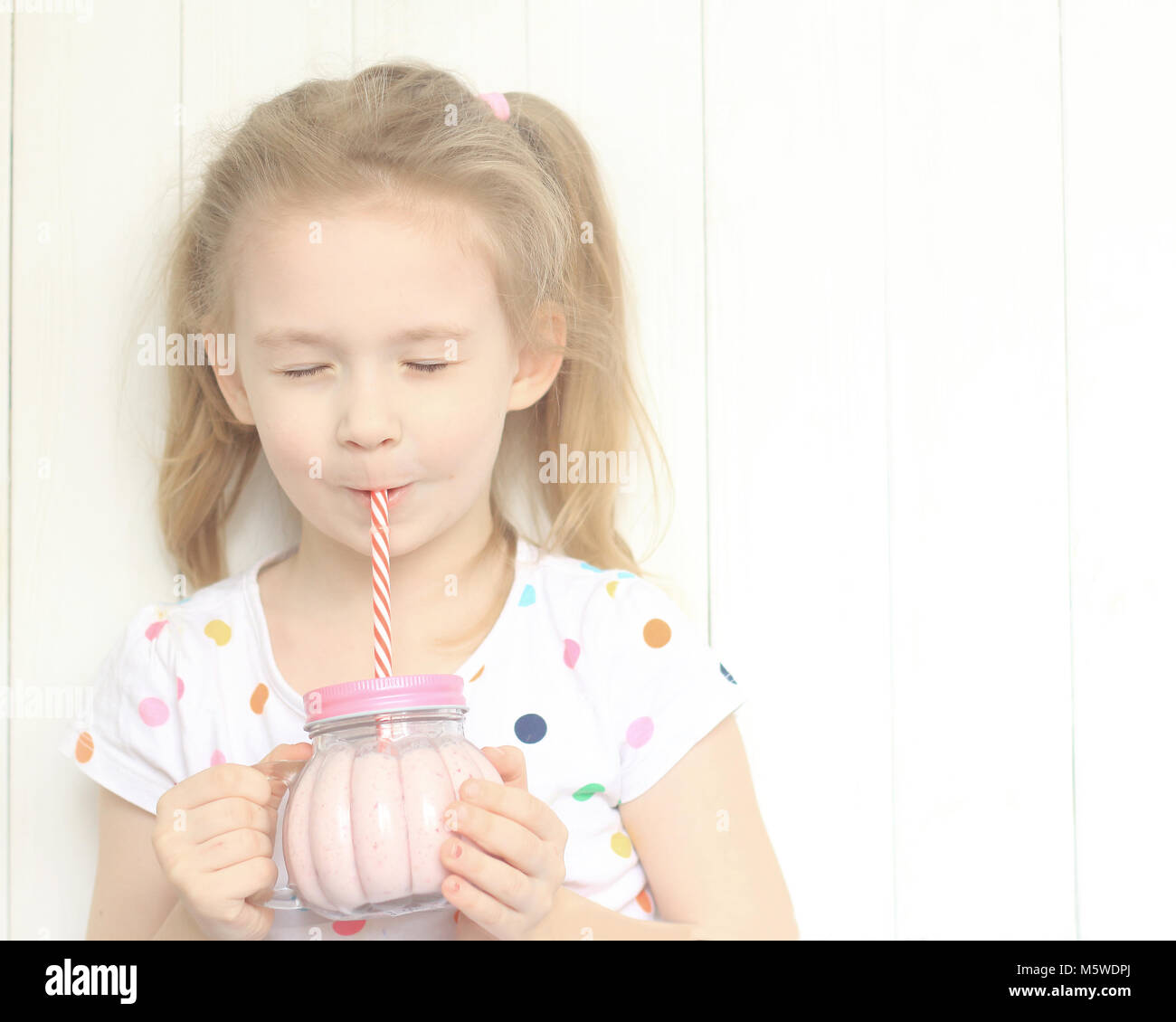 Beautiful girl drinking smoothie shake Stock Photo - Alamy