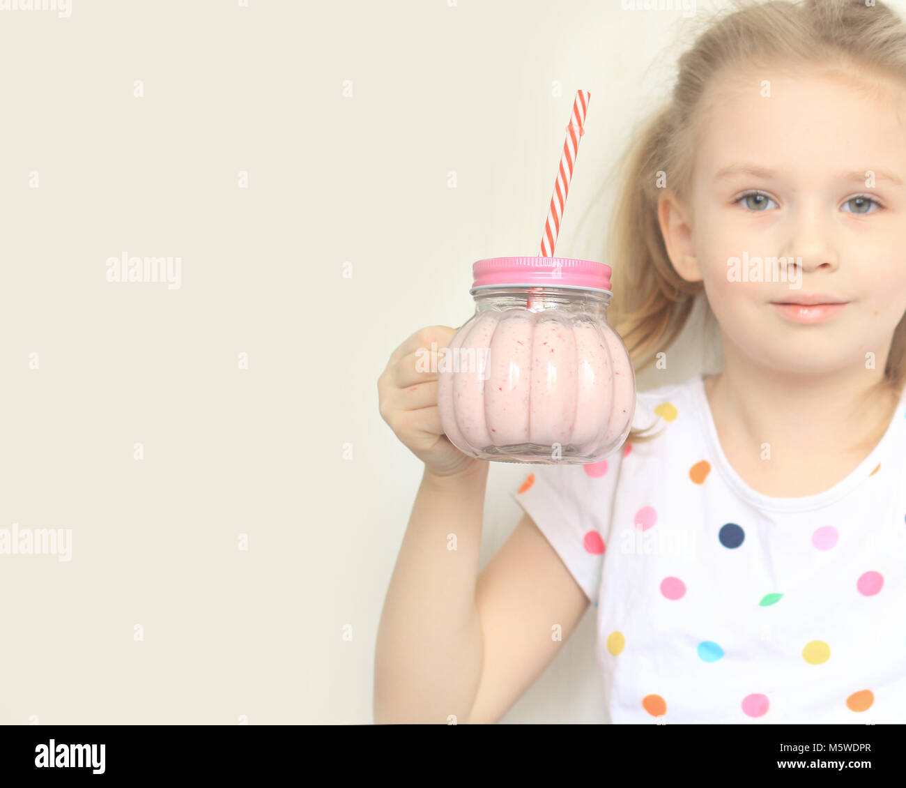 Beautiful girl drinking smoothie shake Stock Photo - Alamy