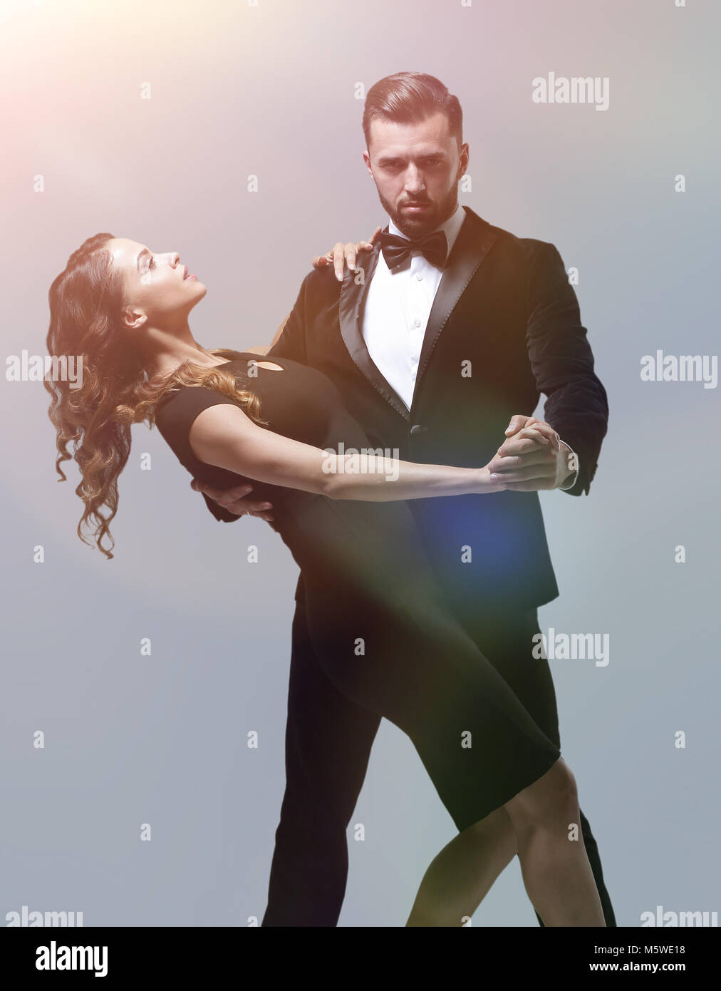 passion dancers over grey background Stock Photo - Alamy