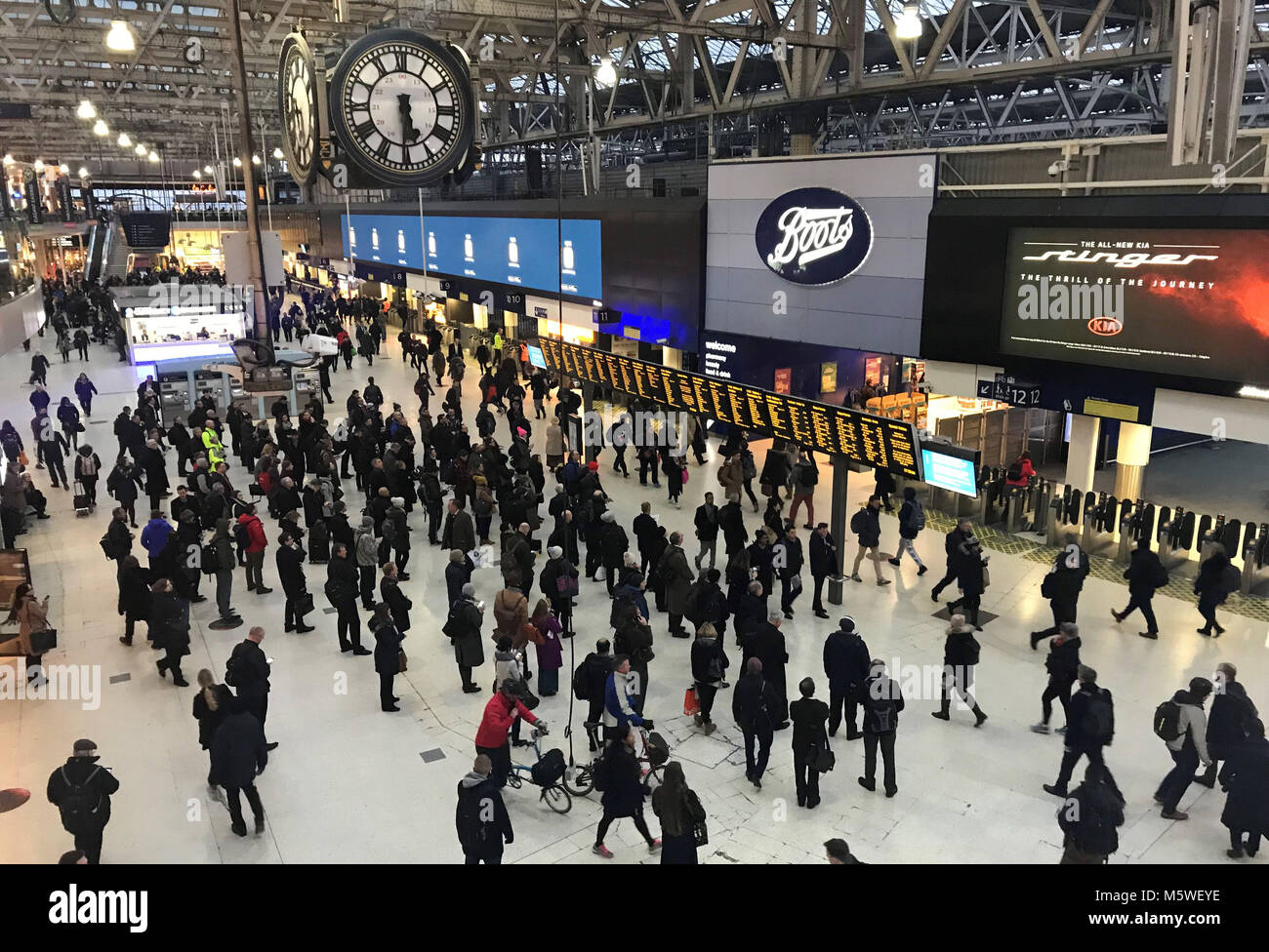 Commuters inside Waterloo Railway Station, London, as they make their ...