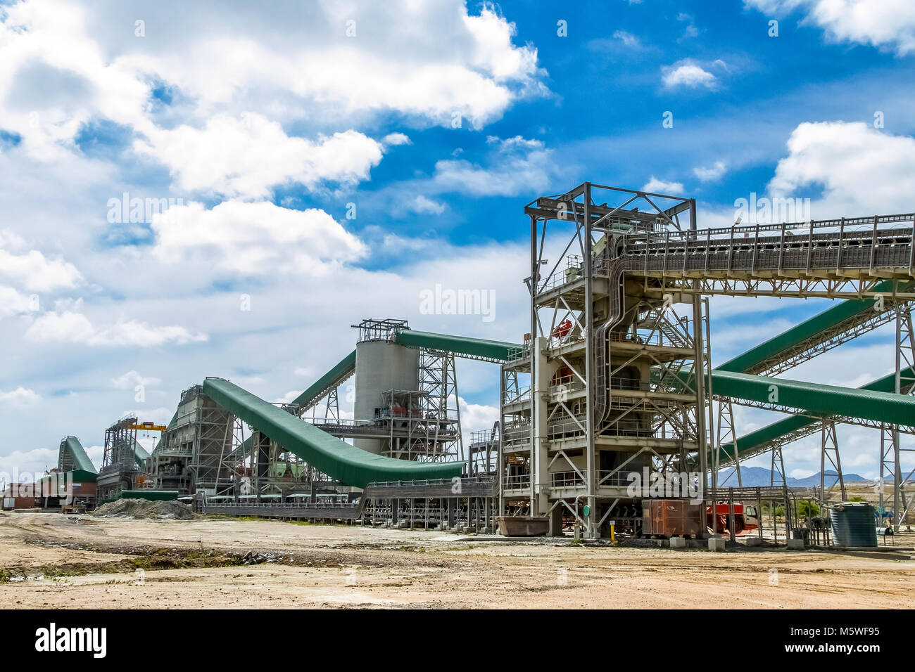 Platinum Mining and Processing of ore, Piles of ore rock being moved ...