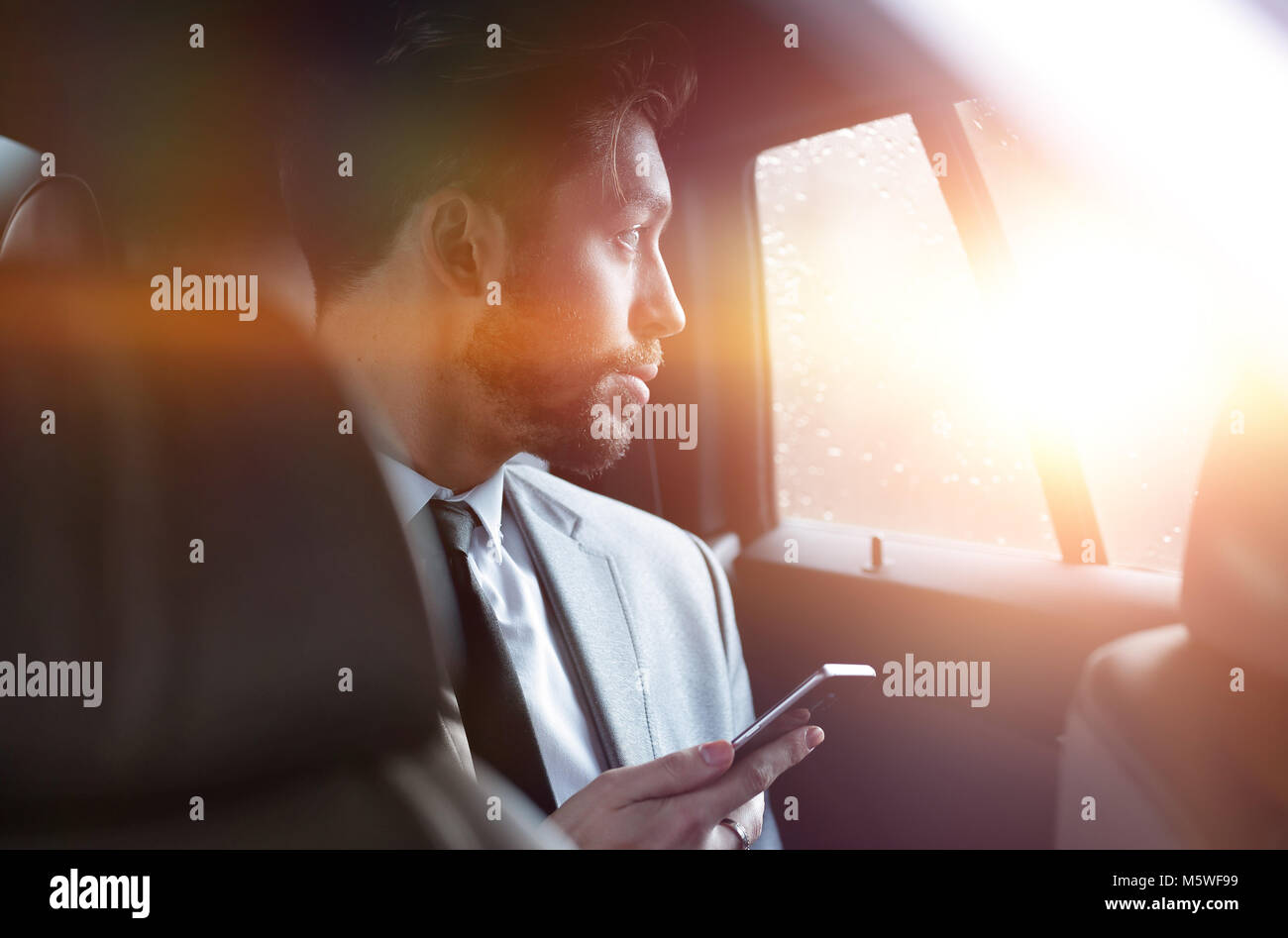 Handsome business man in car Stock Photo - Alamy