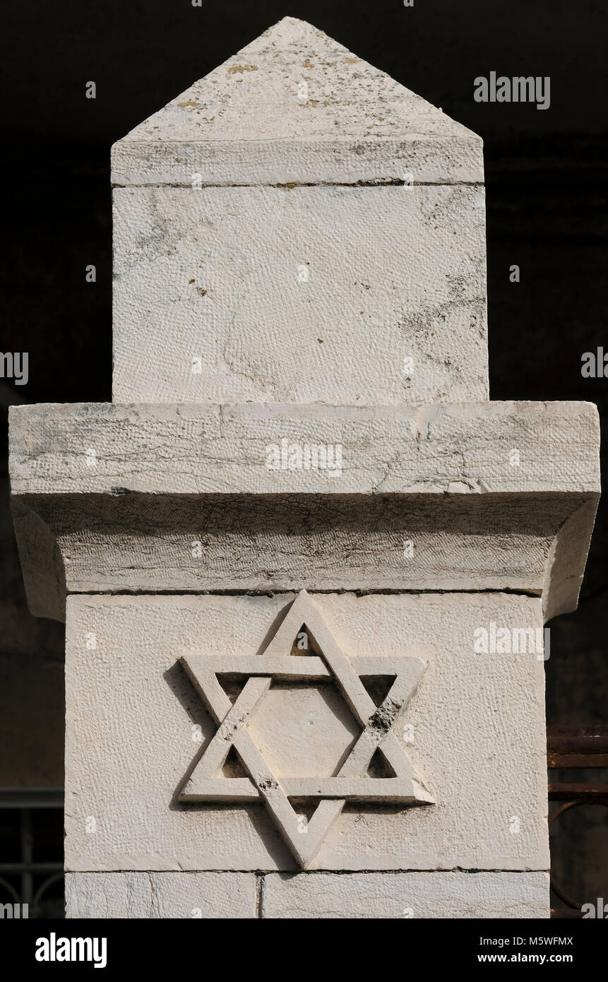 A Jewish Star of David relief on a side post at the entrance to a house ...