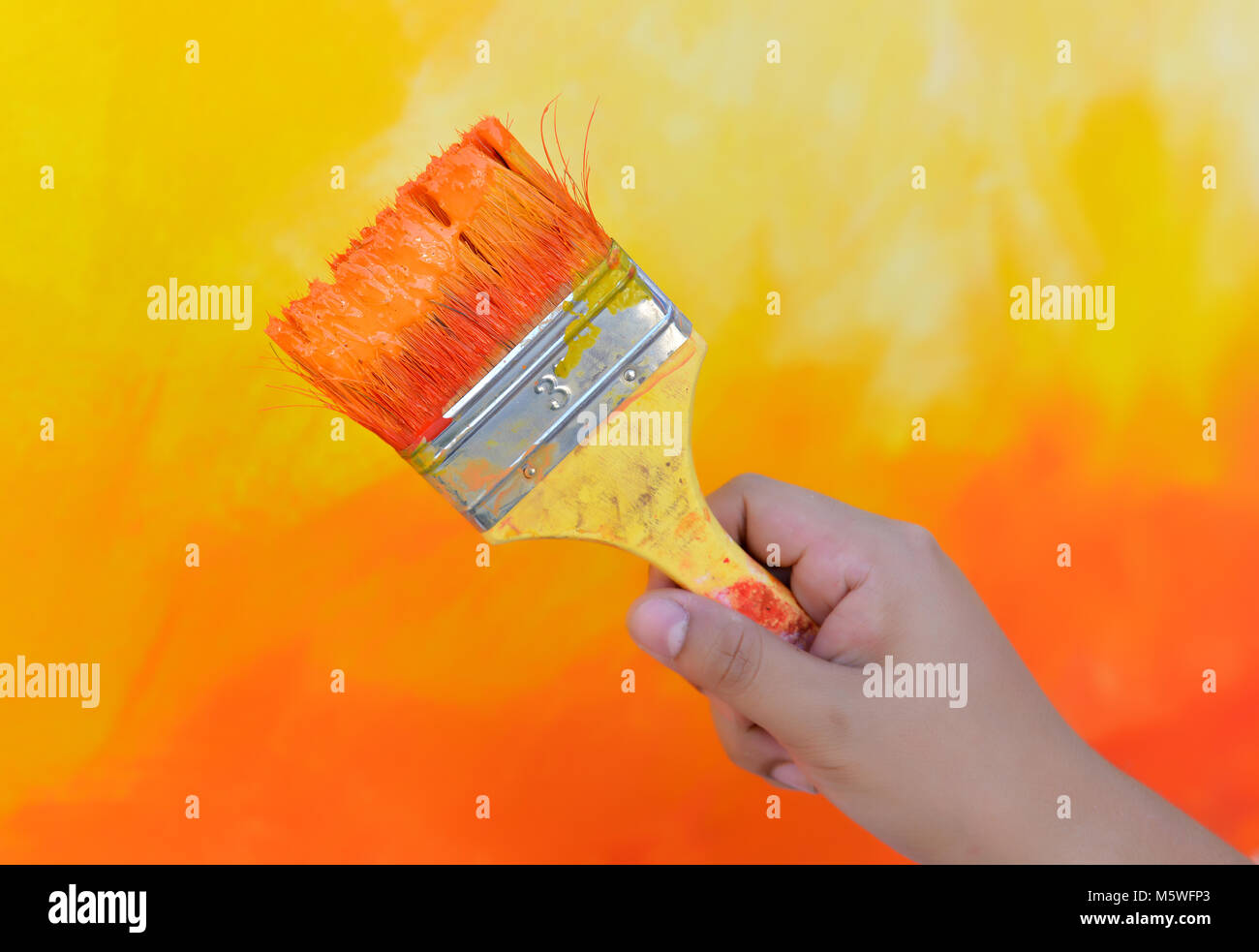 hand on color brush paint mix work on time Stock Photo - Alamy