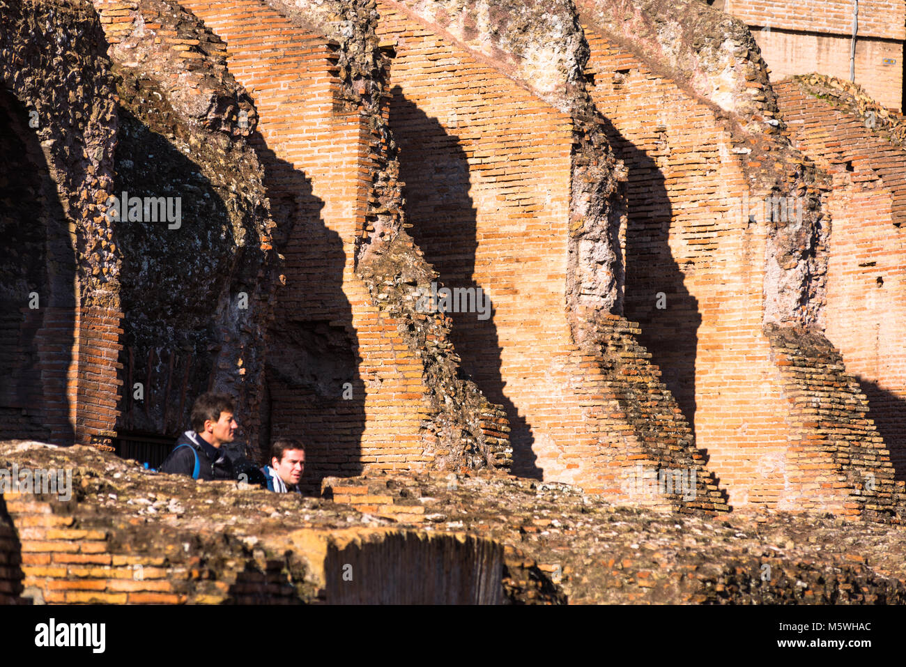 Interior walls and arches of the Colosseum or Coliseum, also known as ...