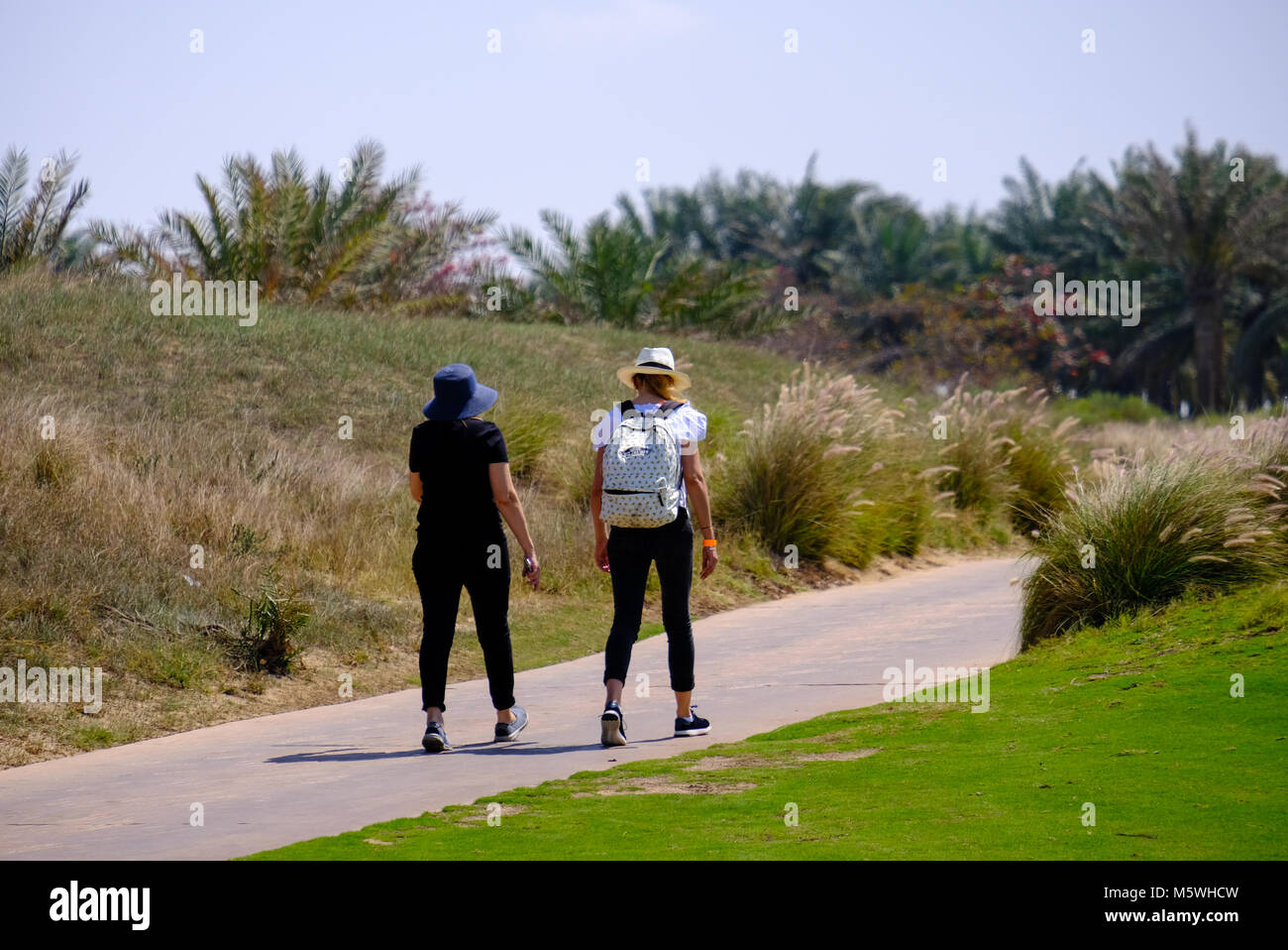 Two girls walking together hi-res stock photography and images - Alamy