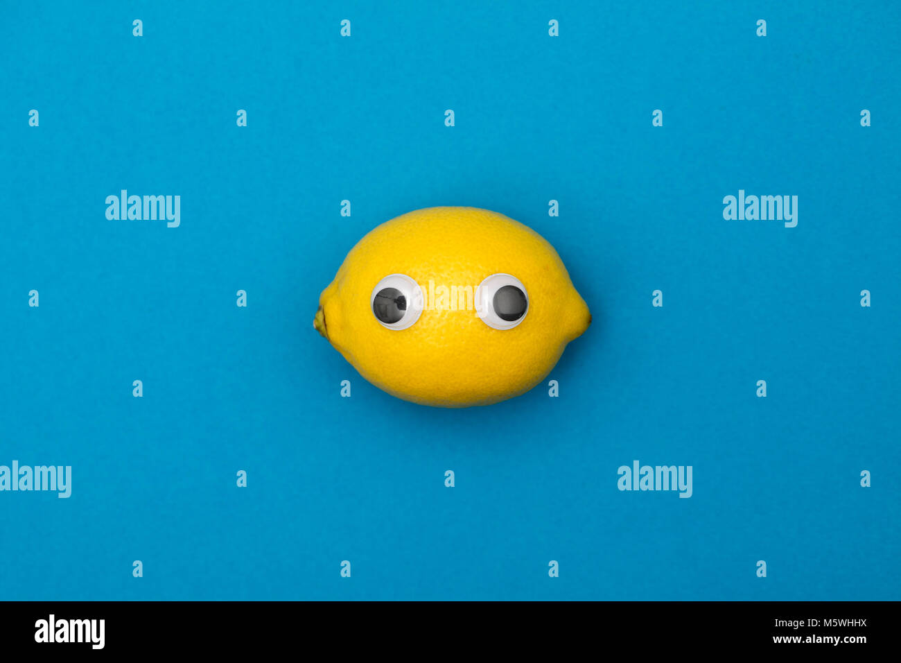 Yellow lemon face with comedy googly eyes Stock Photo - Alamy