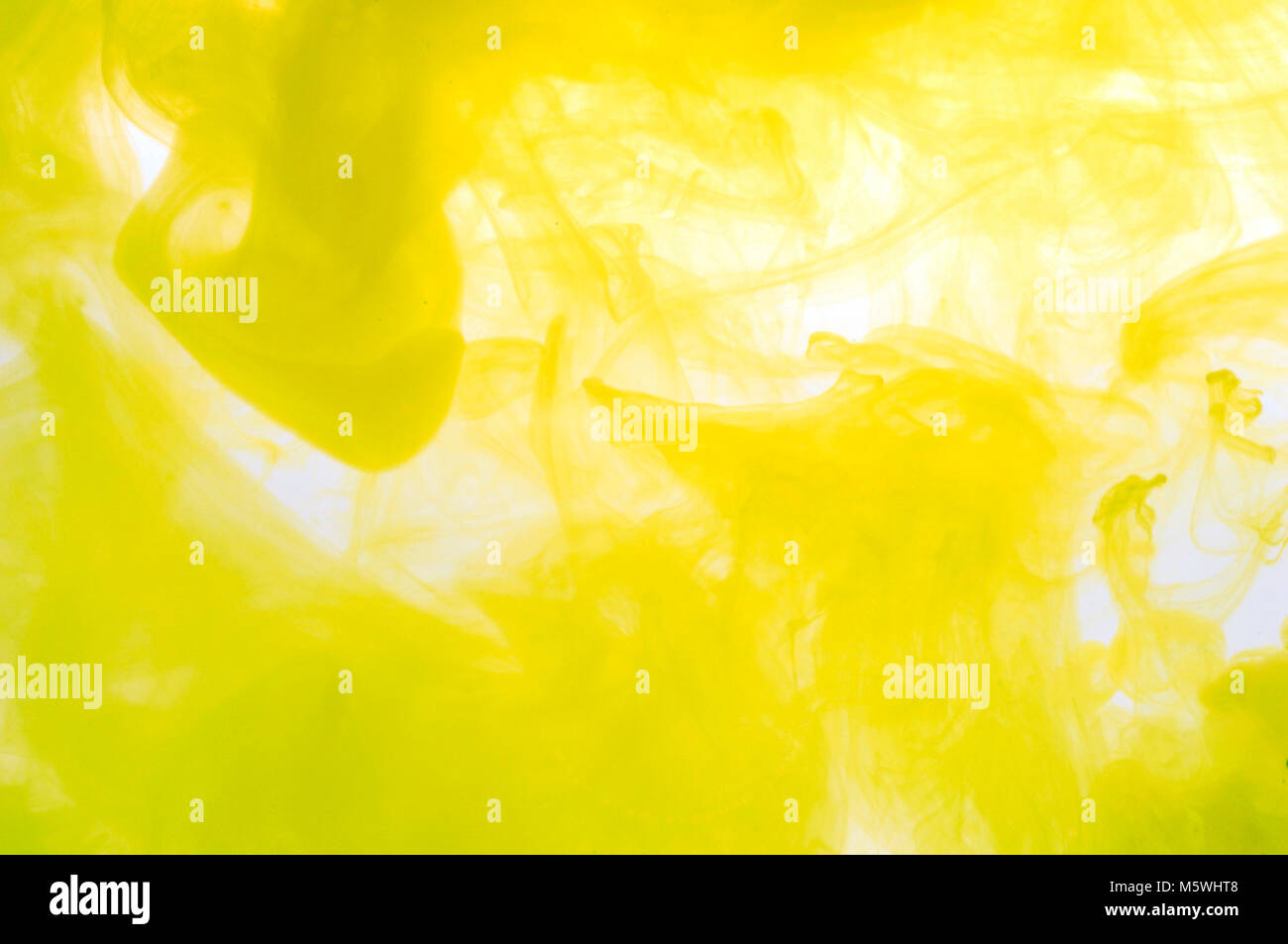 color dissolved in water with white background Stock Photo - Alamy