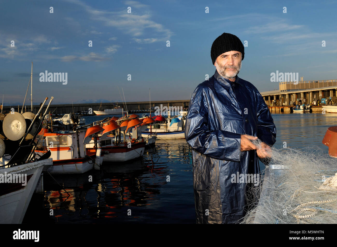 fisherman working in the fishing port Stock Photo - Alamy