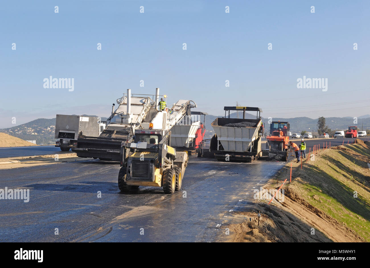 machines that are building a highway Stock Photo - Alamy