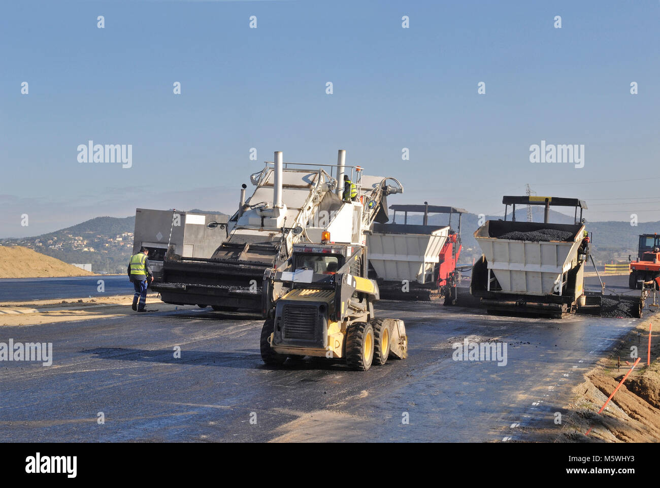 machines that are building a highway Stock Photo - Alamy