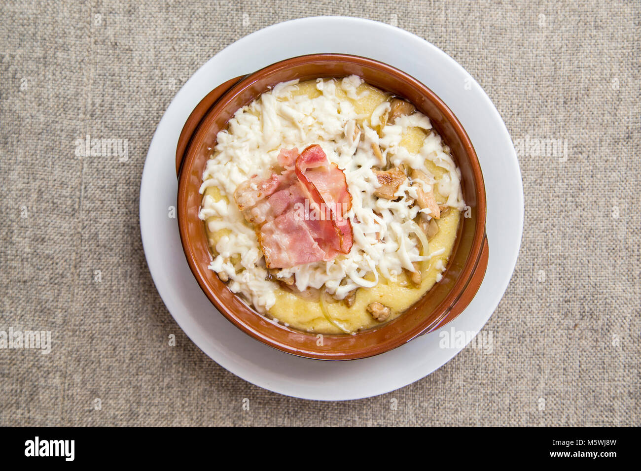 banosh with cheese and bacon Stock Photo - Alamy