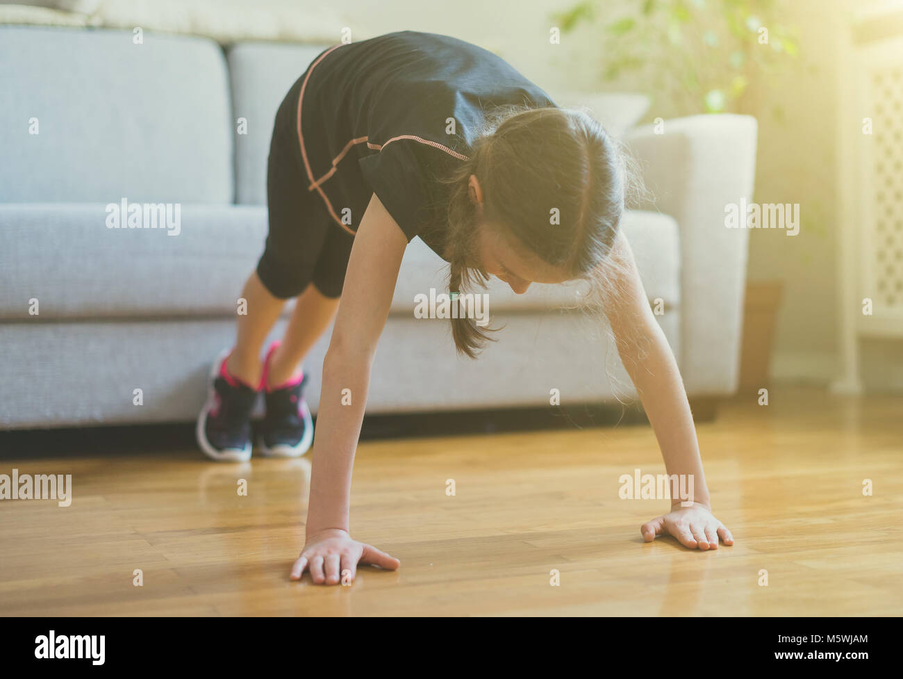 Little girl doing push ups at home. Gymnastics at home Stock Photo - Alamy