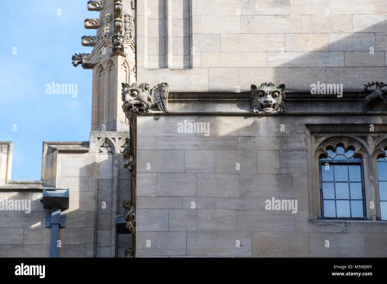 Carved stone gargoyles / grotesques on an oxford university building ...