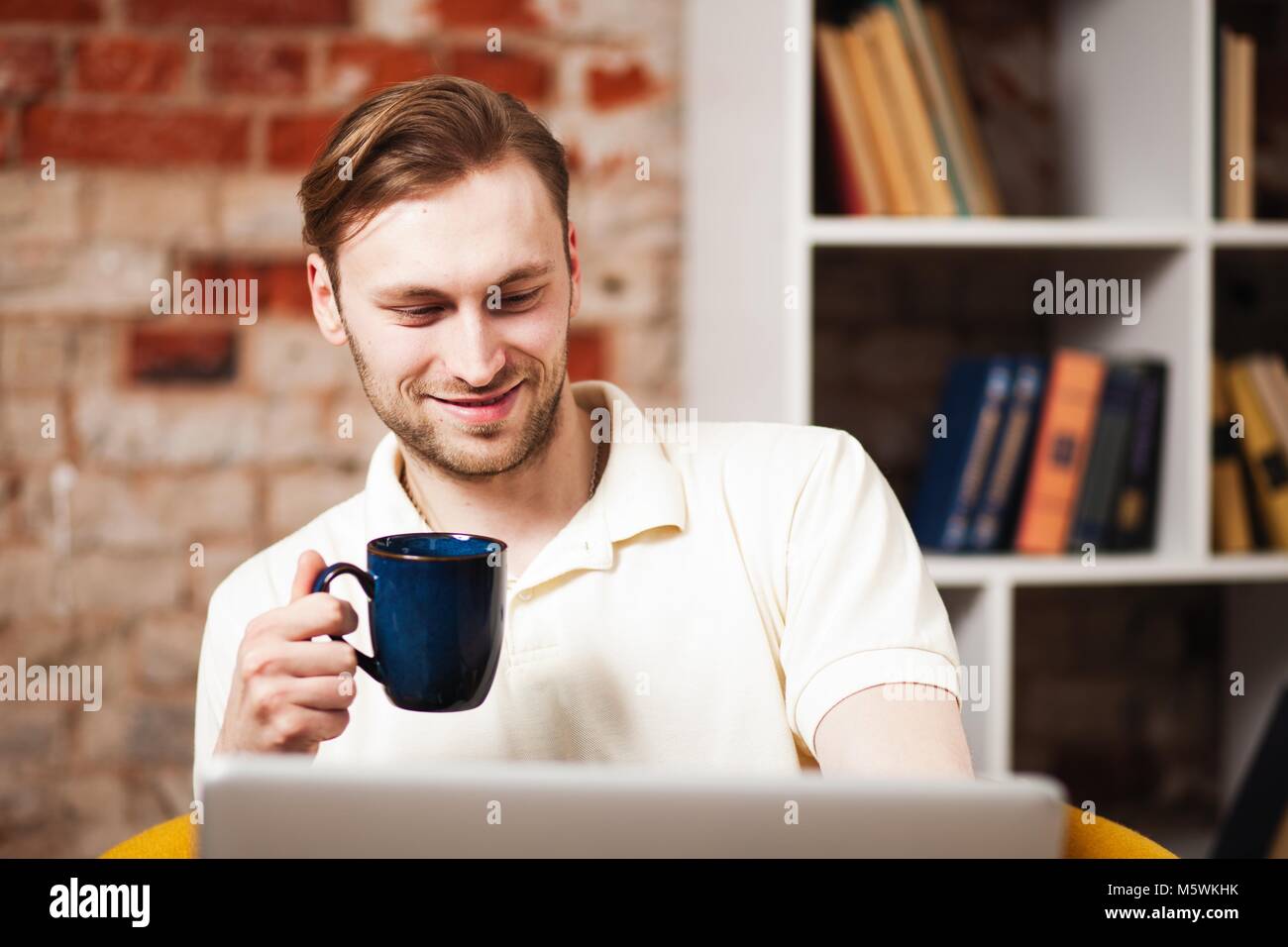 Person paper looking laptop High Resolution Stock Photography and ...