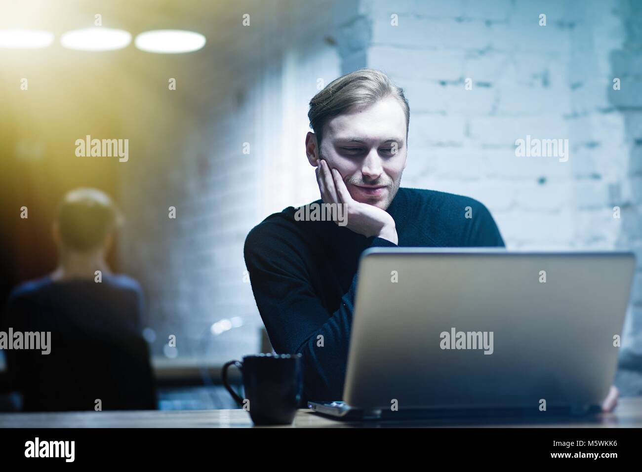 Young man with a laptop Stock Photo - Alamy
