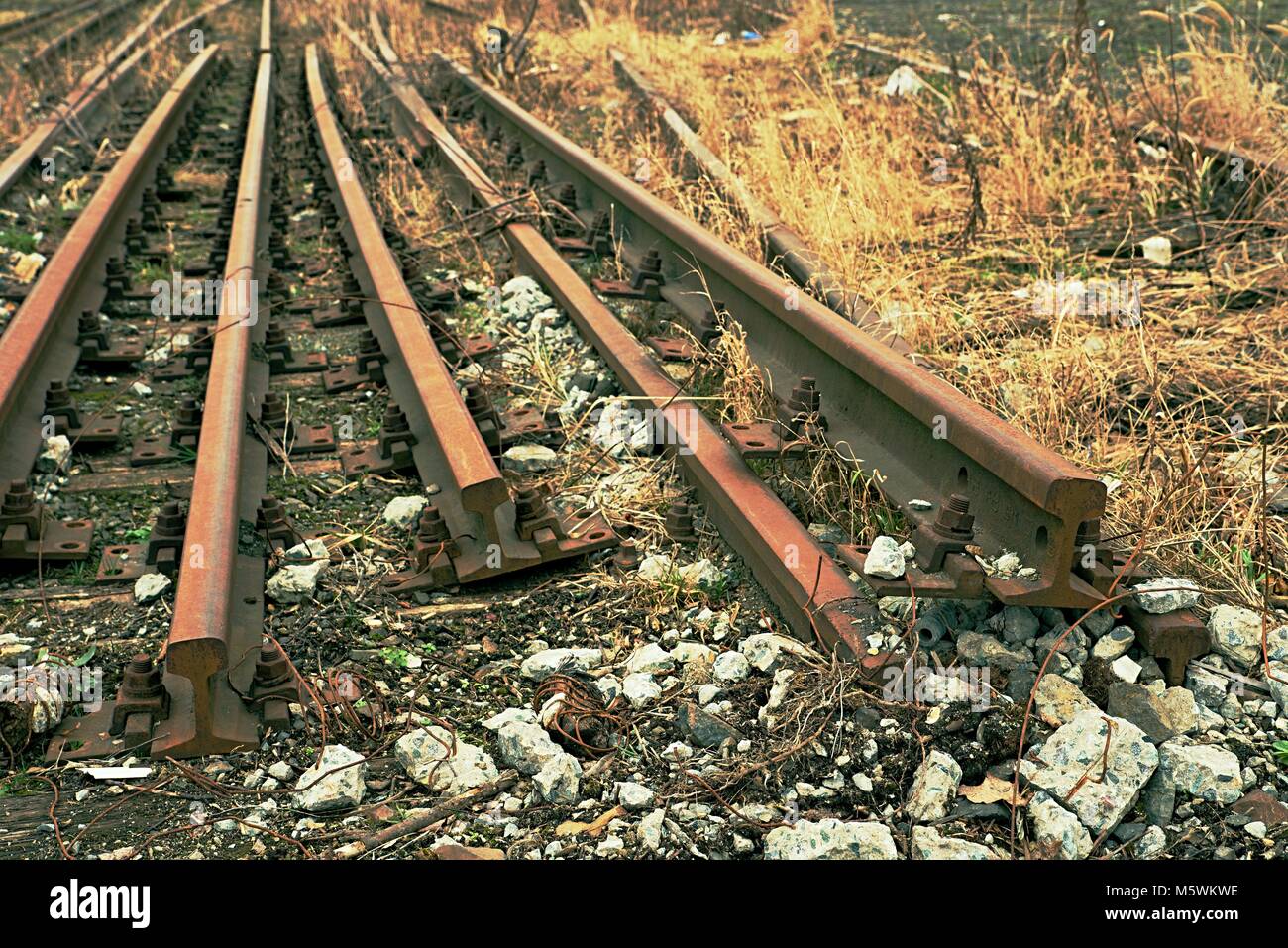 Old rusty railways. Railway details of rails joint with screws and nuts ...