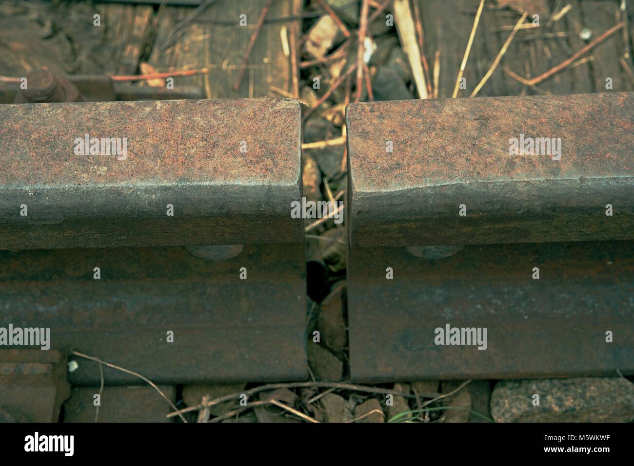 Old rusty railways. Railway details of rails joint with screws and nuts ...