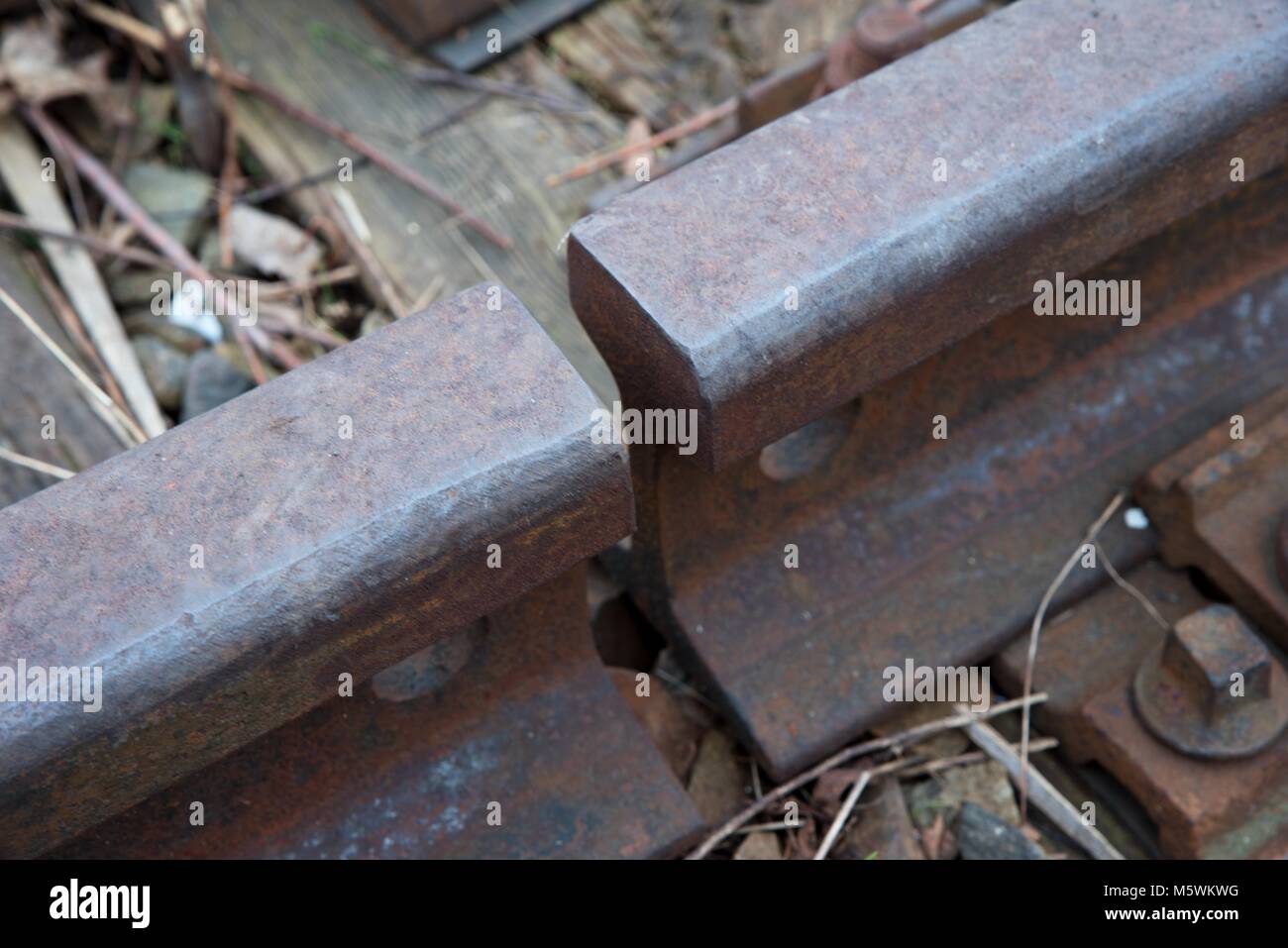 Old rusty railways. Railway details of rails joint with screws and nuts ...