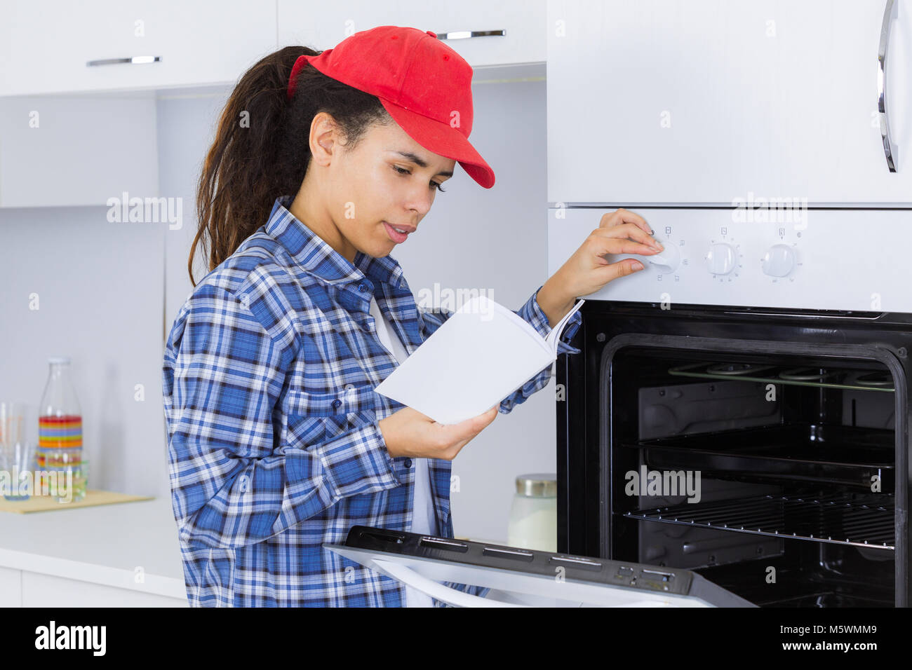 female oven technician Stock Photo - Alamy