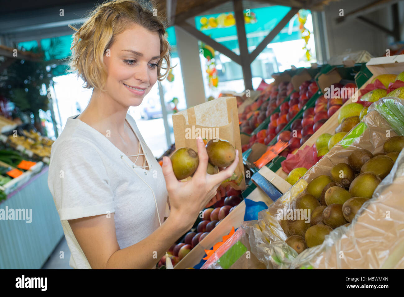 happy pregnant woman buying pears Stock Photo - Alamy